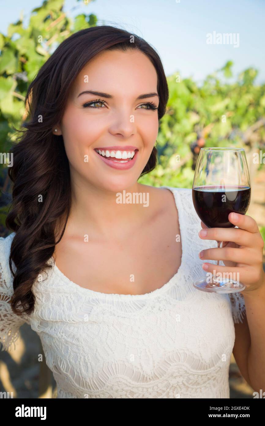 Pretty Mixed Race Young Adult Woman Enjoying A Glass of Wine in the ...