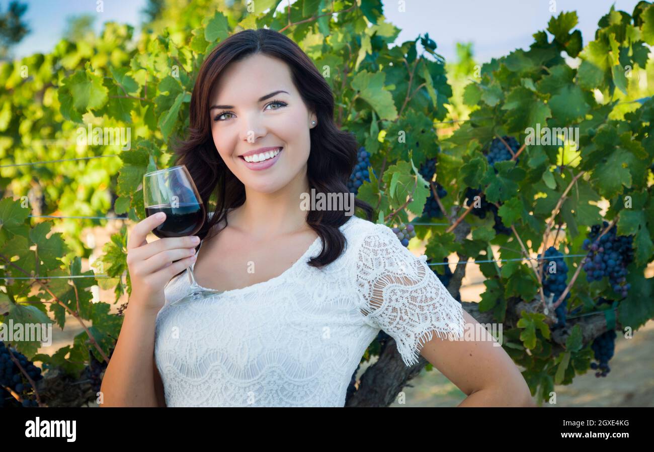 Pretty Mixed Race Young Adult Woman Enjoying A Glass of Wine in the ...
