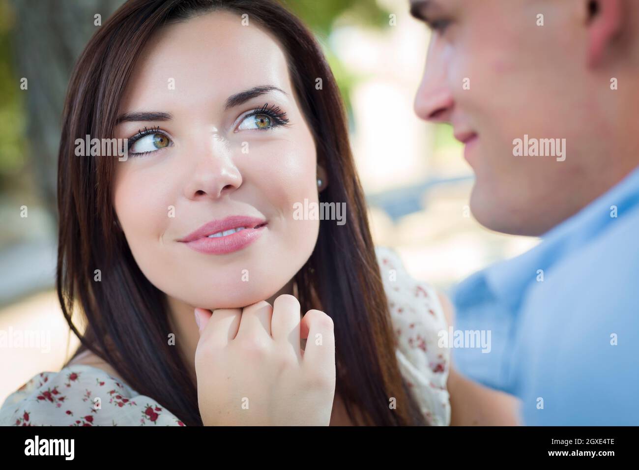 Happy Mixed Race Romantic Couple Portrait in the Park Stock Photo - Alamy