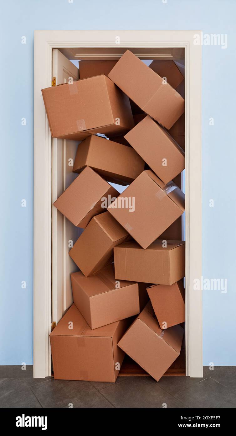 Entrance full with cardboard boxes Stock Photo - Alamy