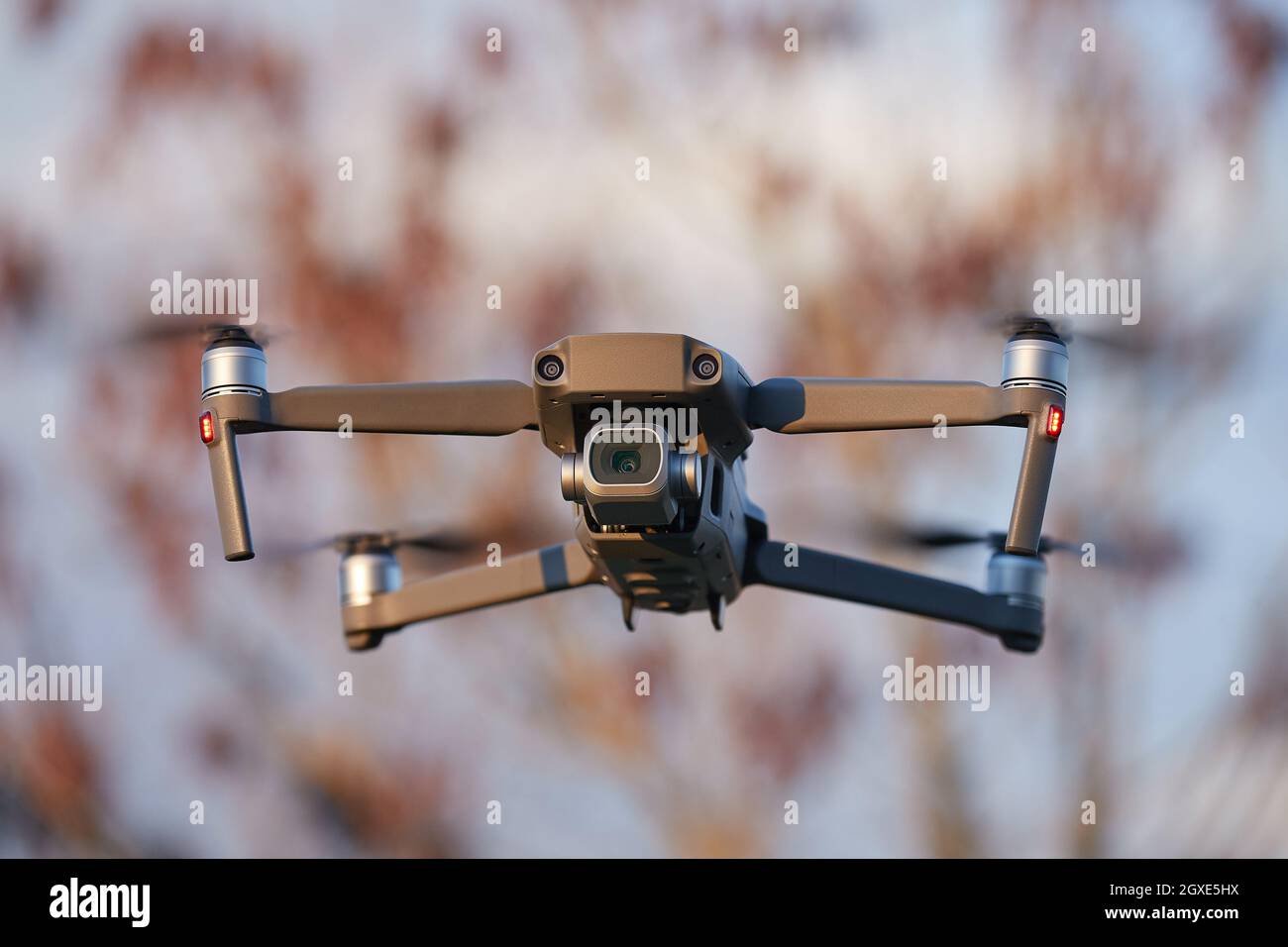 Drone midflight closeup outdoor flying, tree in background Stock Photo ...