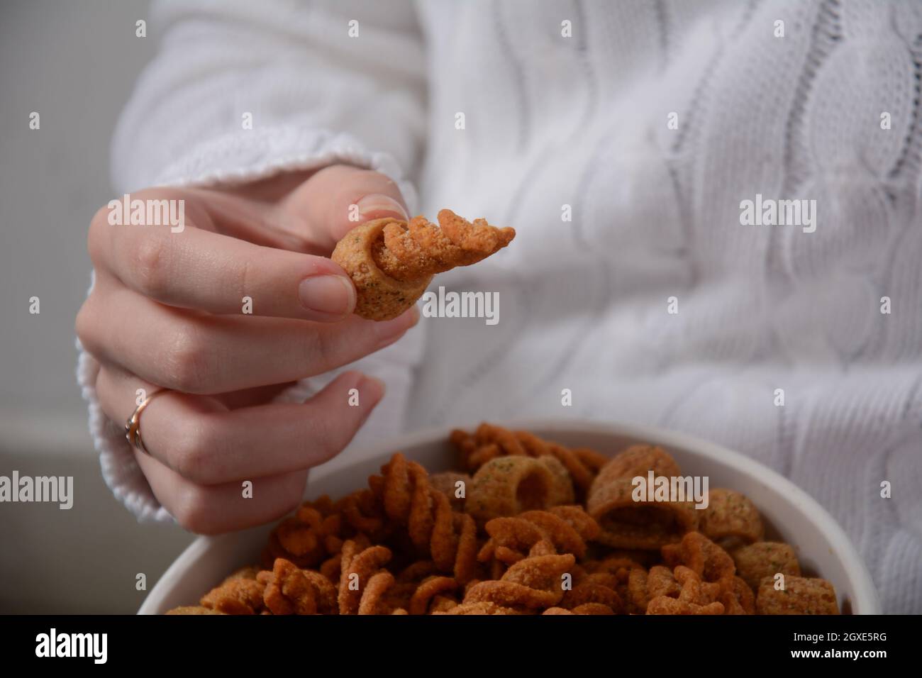 A bowl of Israeli Bissli wheat snacks with different flavors and shapes ...