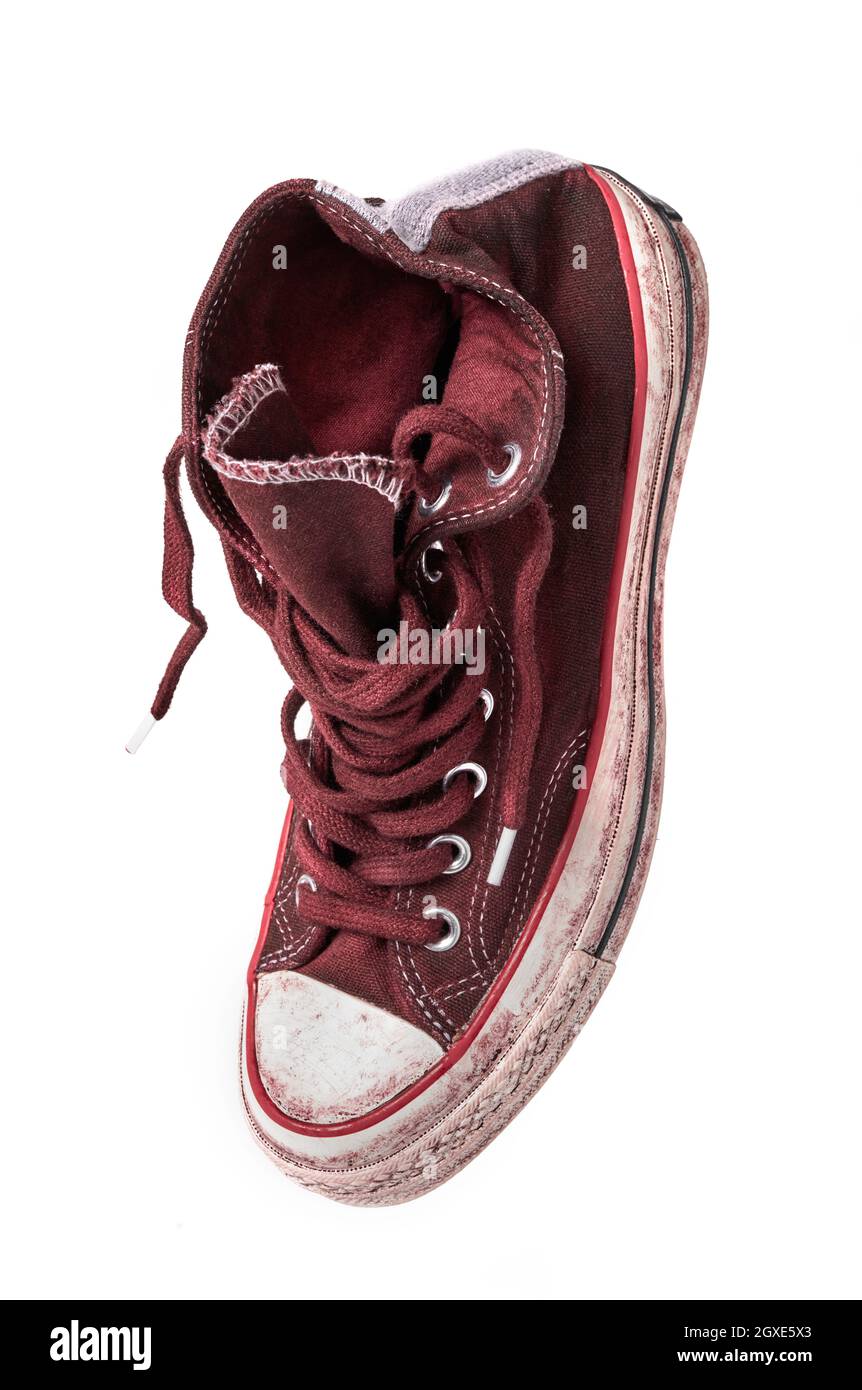 Used canvas shoe on white background Stock Photo - Alamy
