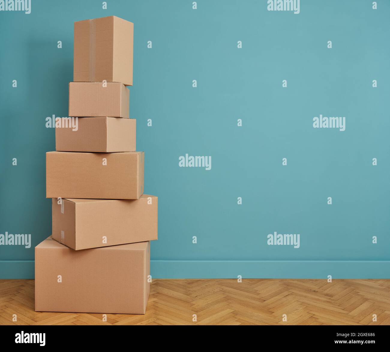 Cardboard boxes in room Stock Photo - Alamy