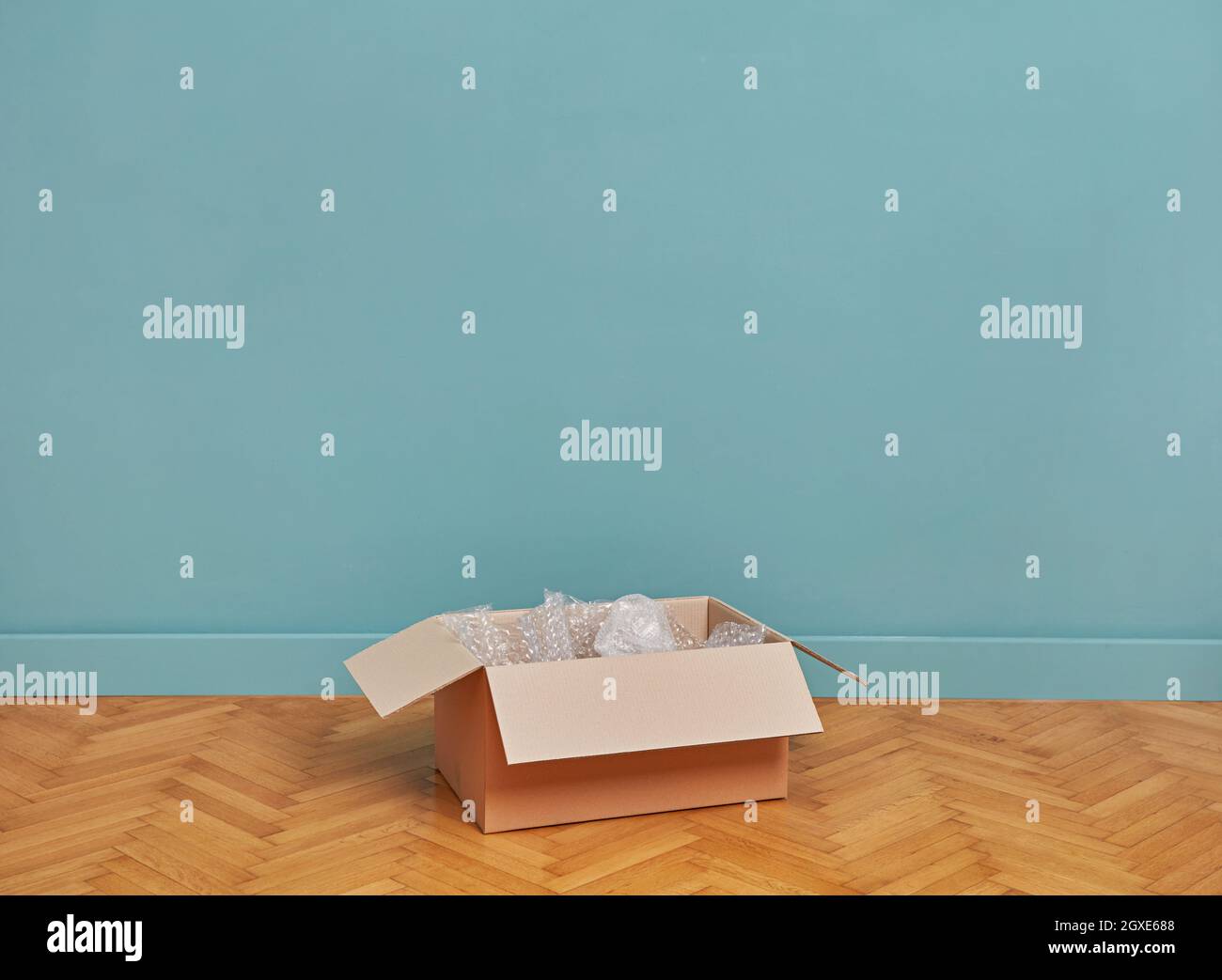 Cardboard boxes in room Stock Photo - Alamy