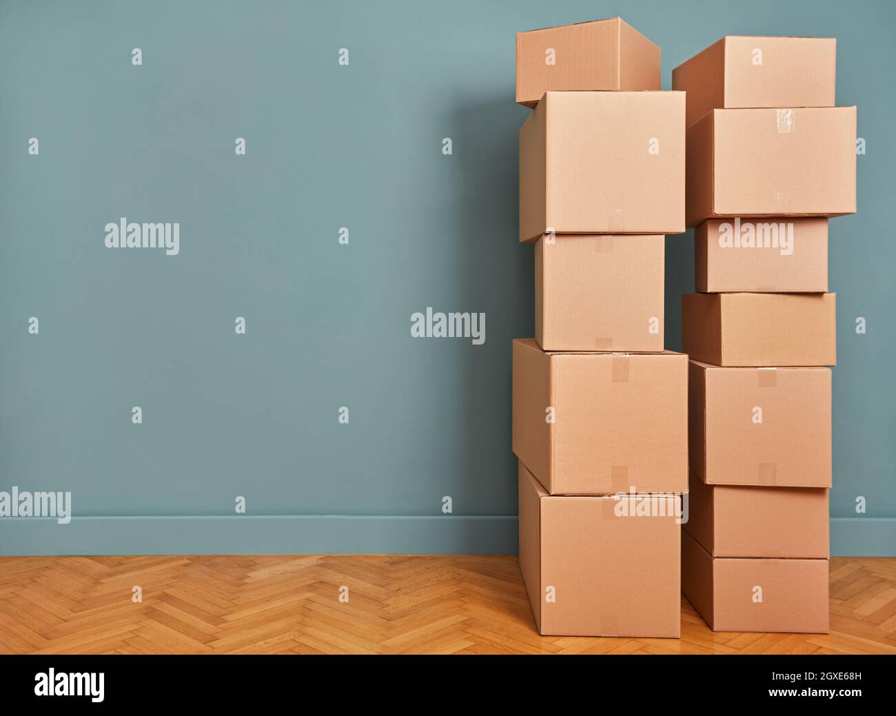 Cardboard boxes in room Stock Photo - Alamy