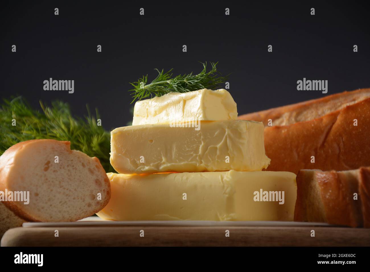 Butter. Slices of butter with parsley and bread Stock Photo - Alamy