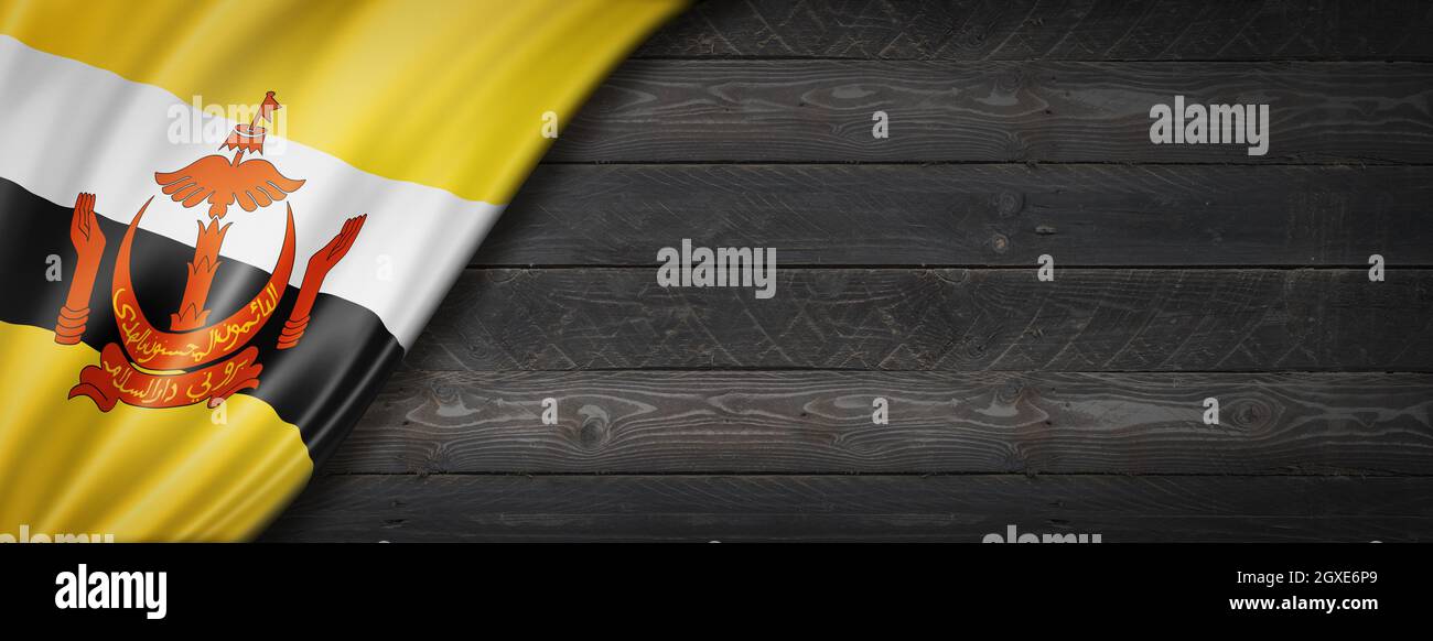 Brunei flag on black wood wall. Horizontal panoramic banner Stock Photo ...