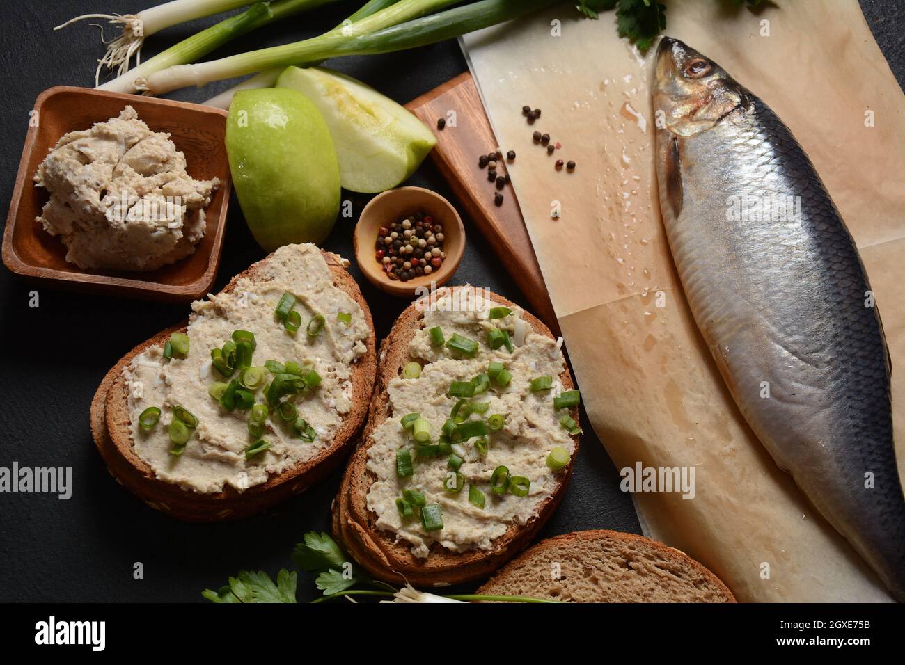 Traditional Jewish snack vorschmack or forshmak with bread and green ...