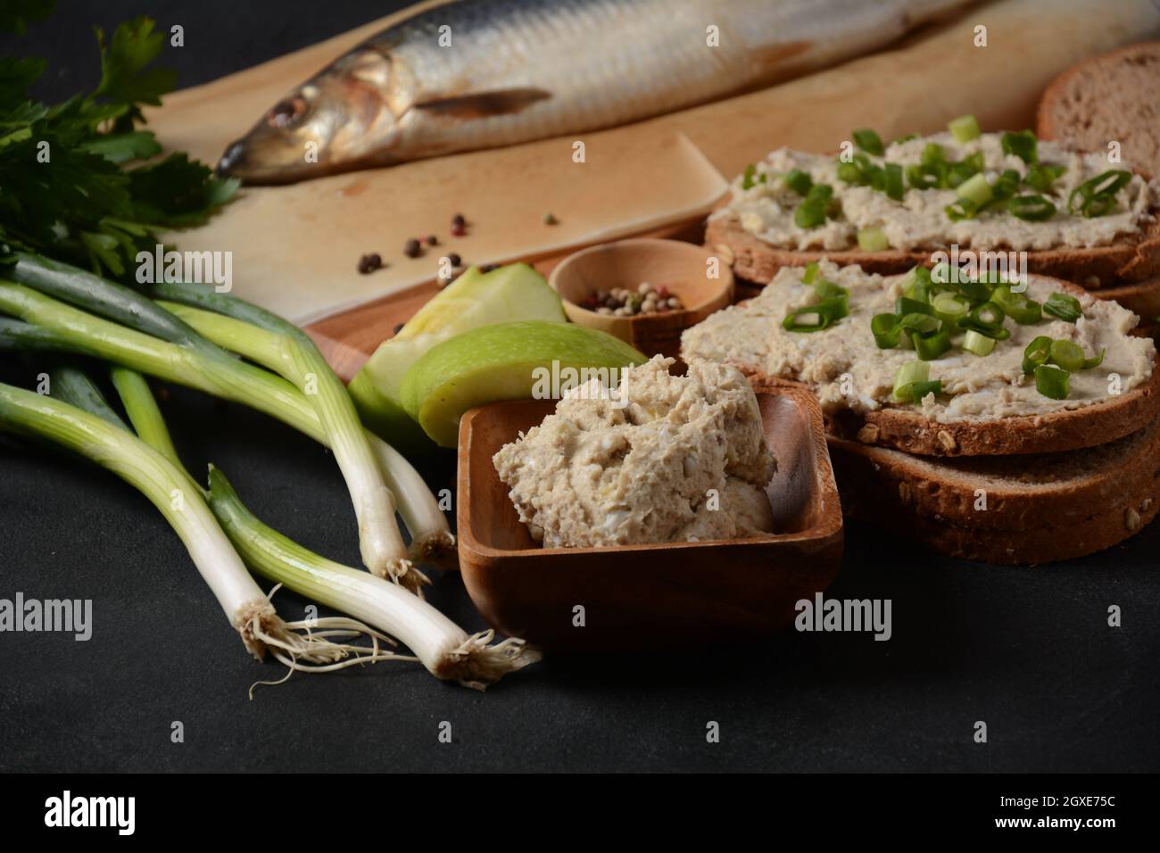 Traditional Jewish snack vorschmack or forshmak with bread and green ...