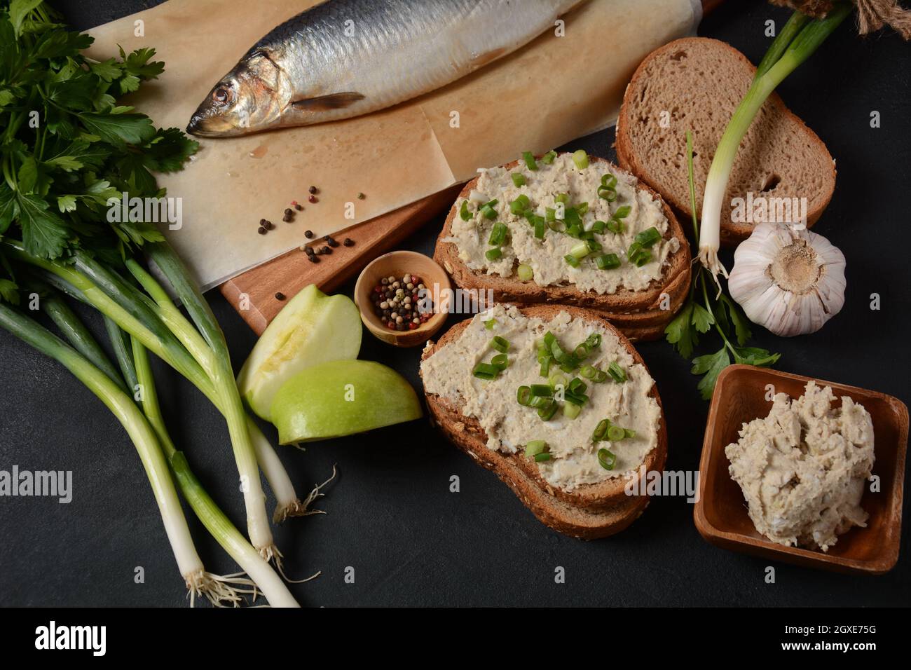 Traditional Jewish snack vorschmack or forshmak with bread and green ...