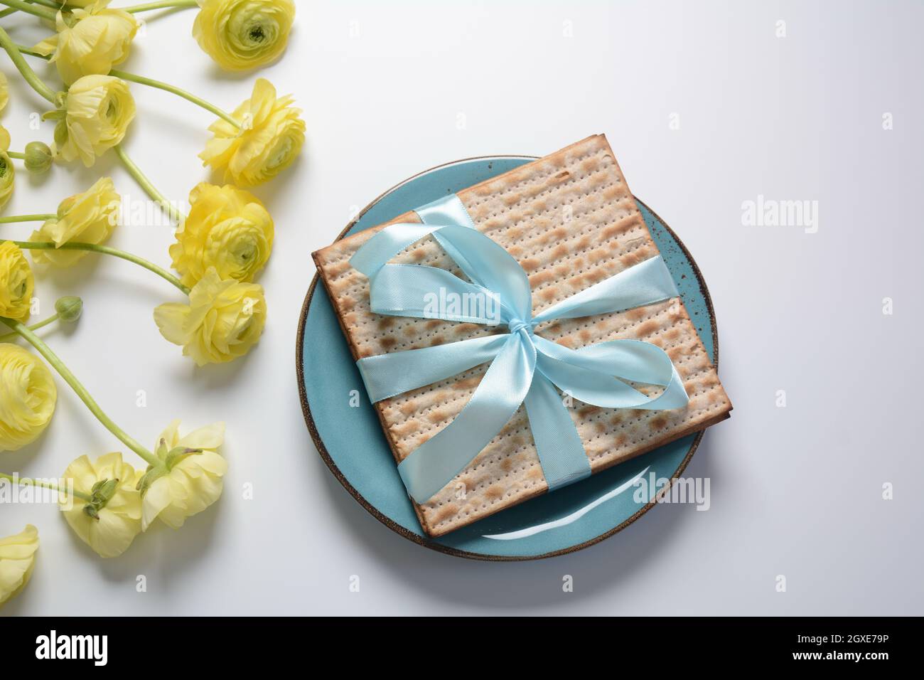 Table served for Passover (Pesach) indoors, with matzah bread as ...