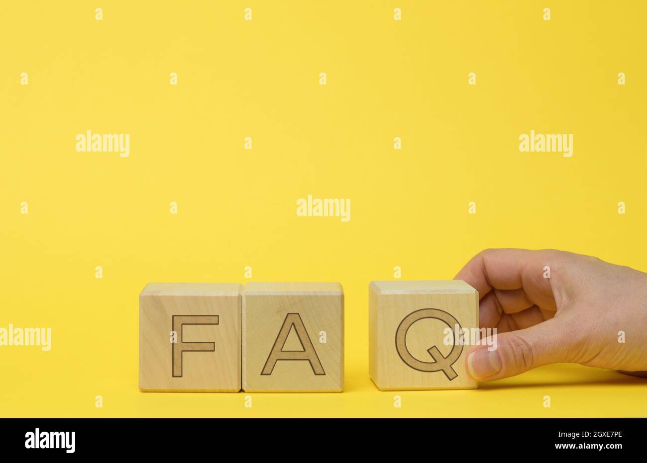 inscription FAQ (frequently asked questions) on wooden blocks on a ...