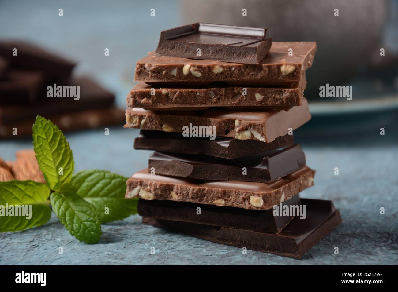 Chocolate tower. Stack of chocolate pieces. The chunks of broken ...