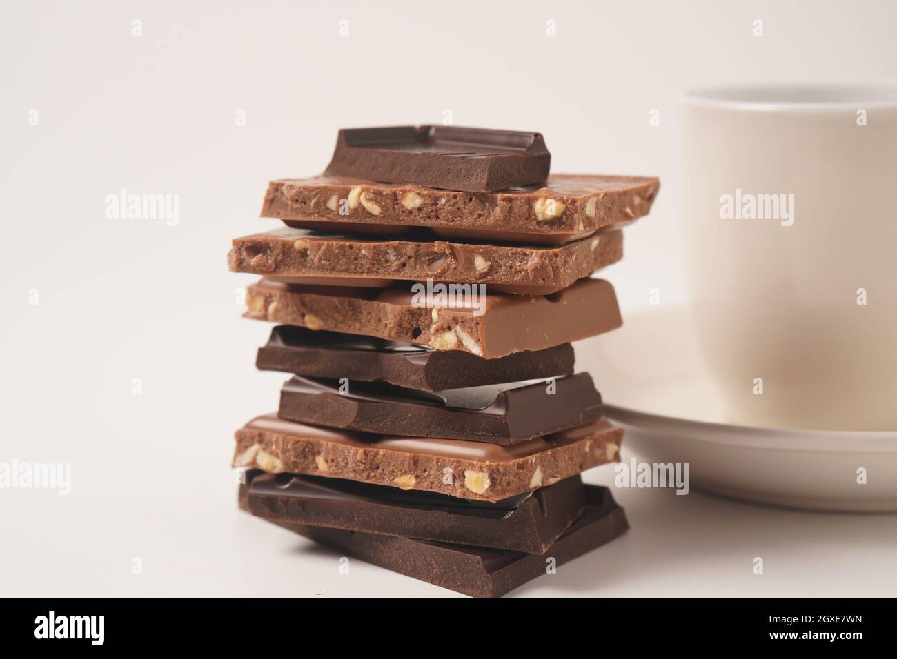 Chocolate tower. Stack of chocolate pieces. The chunks of broken ...