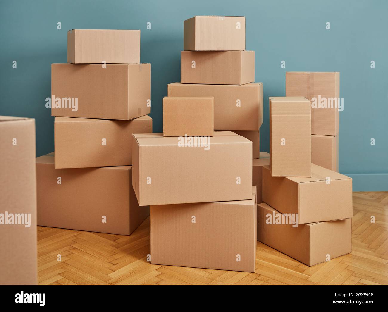 Cardboard boxes in room Stock Photo - Alamy