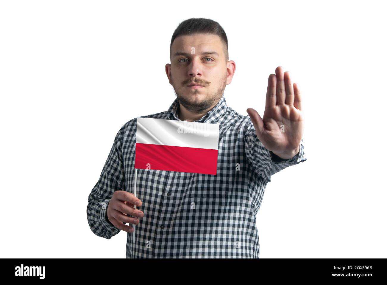 White guy holding a flag of Poland and with a serious face shows a hand ...