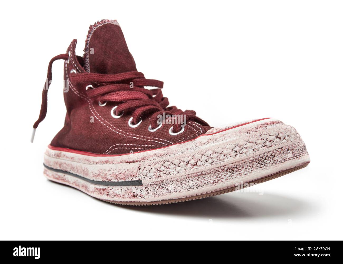 Used canvas shoe on white background Stock Photo - Alamy