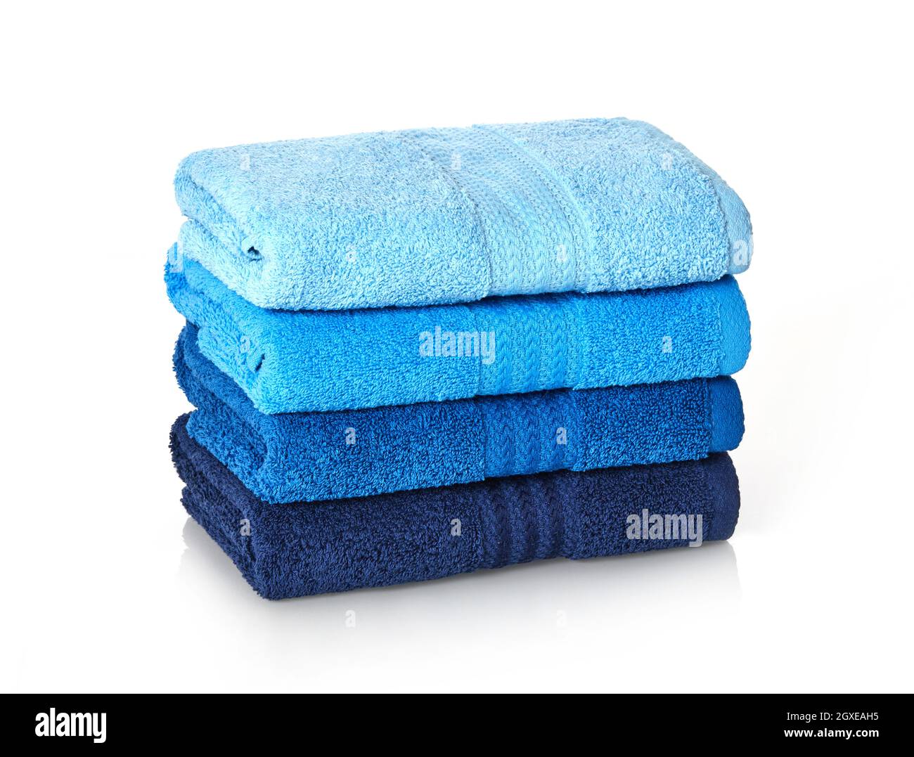 Folded stack of towels on white background Stock Photo - Alamy