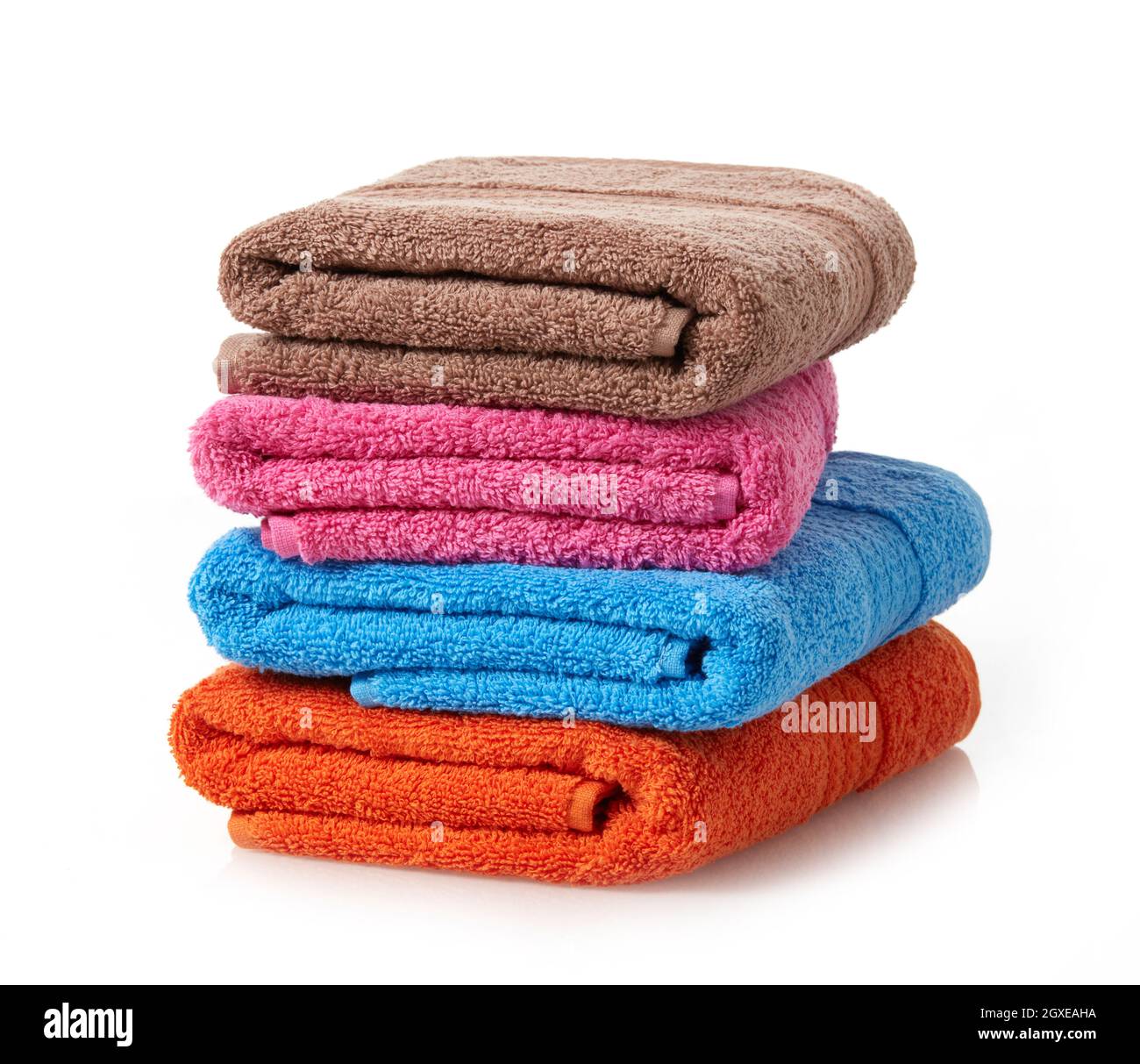 Folded stack of towels on white background Stock Photo - Alamy