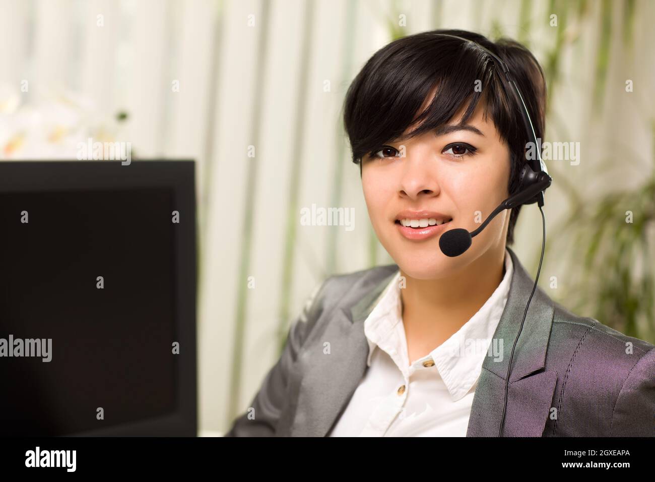 Attractive Young Woman Smiles Wearing Headset Near Her Computer Monitor ...