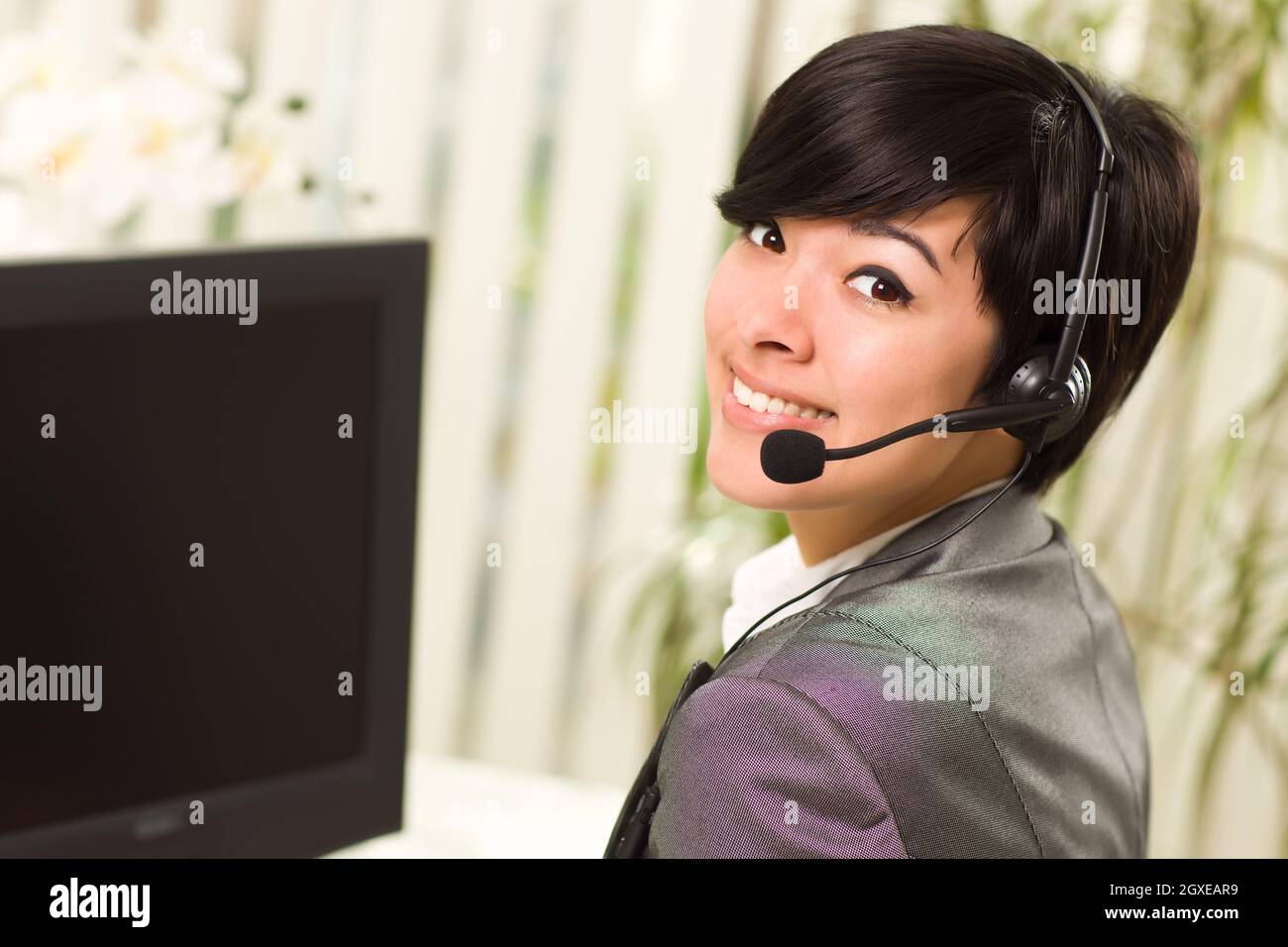 Attractive Young Woman Smiles Wearing Headset Near Her Computer Monitor ...