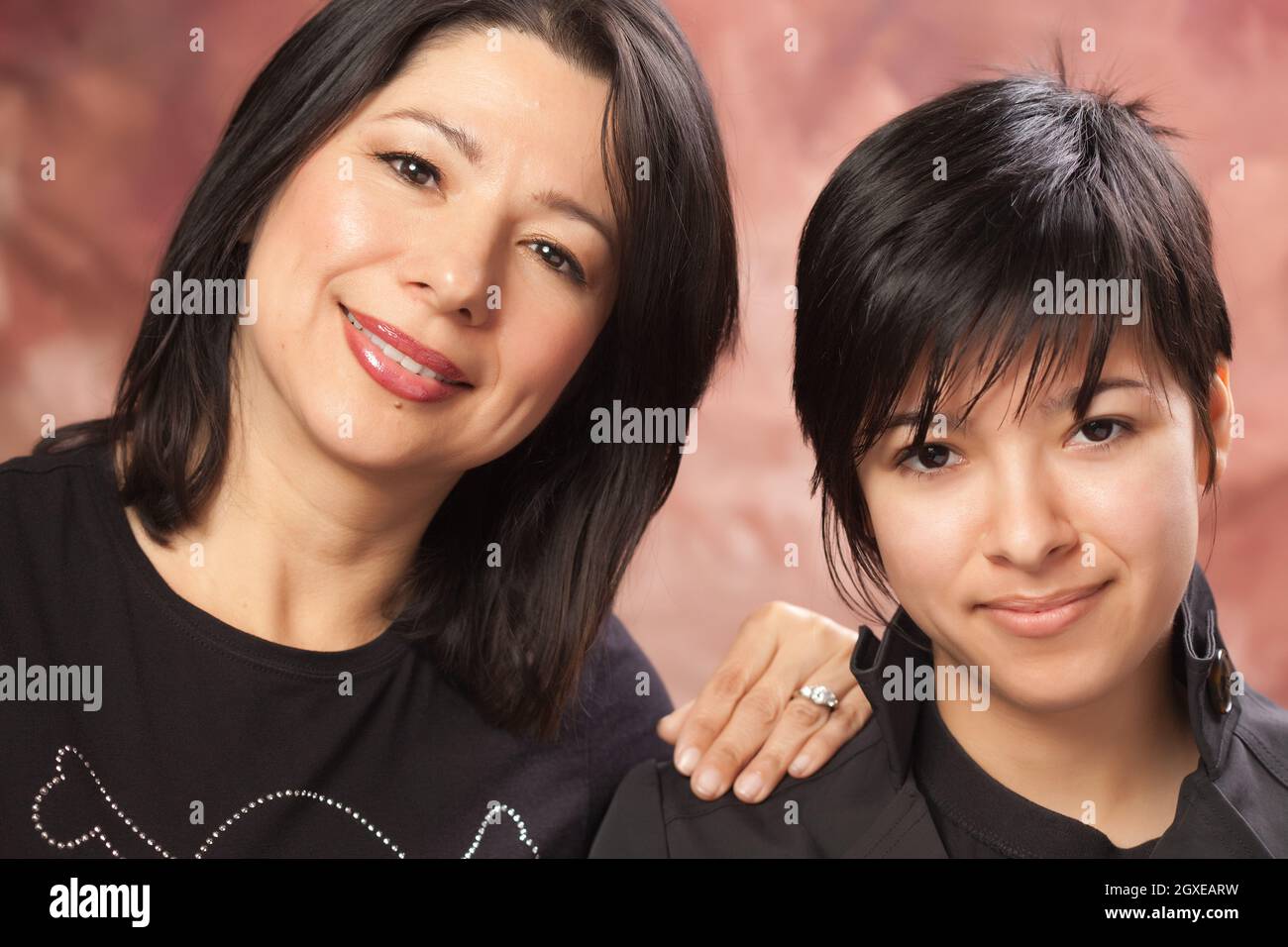 Attractive Multiethnic Mother and Daughter Studio Portrait Stock Photo ...