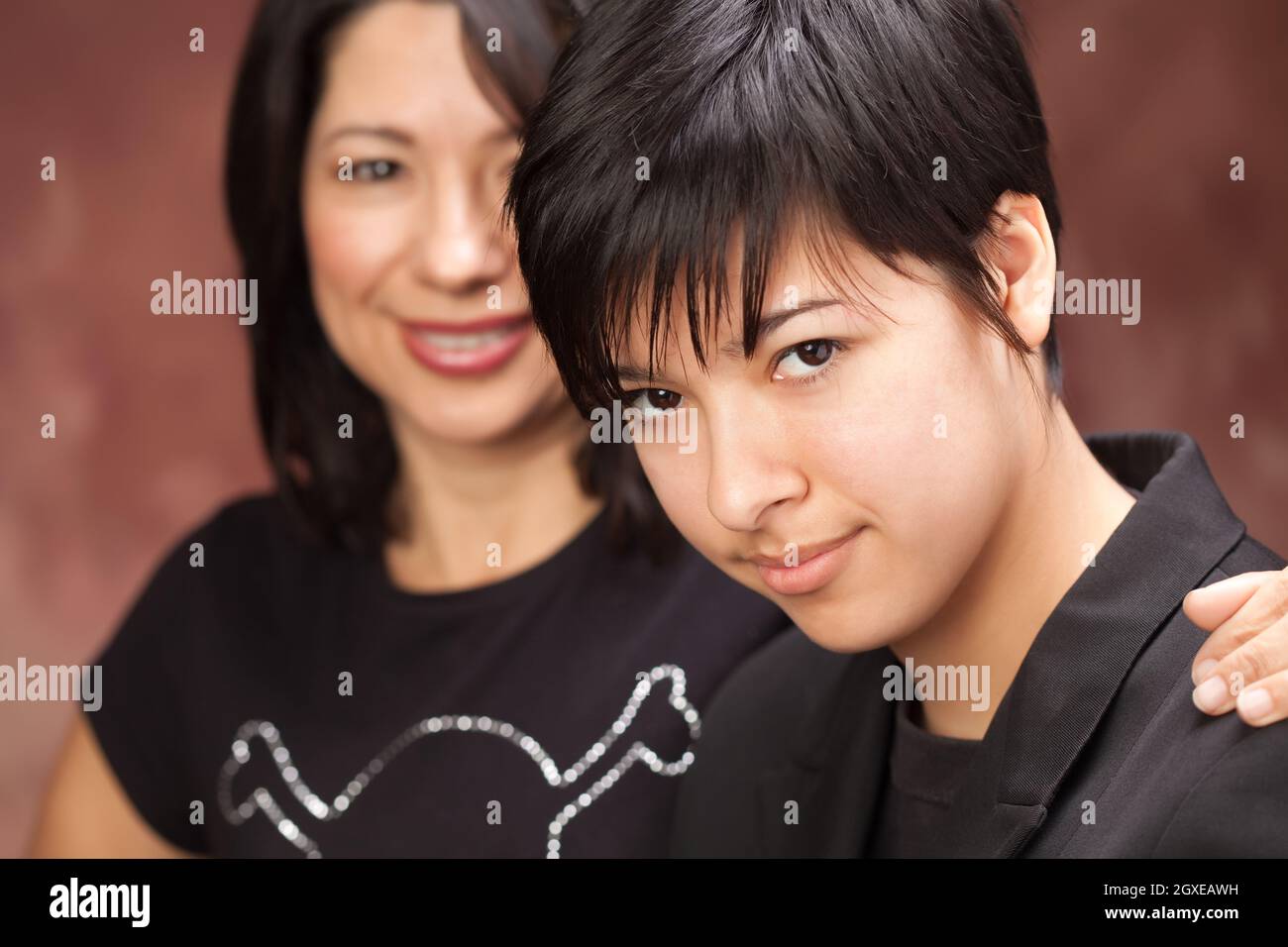 Attractive Multiethnic Mother and Daughter Studio Portrait Stock Photo ...