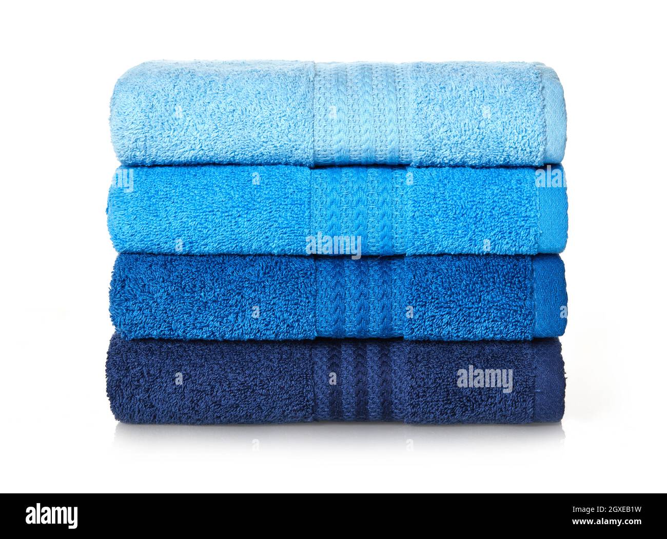 Folded stack of towels on white background Stock Photo - Alamy