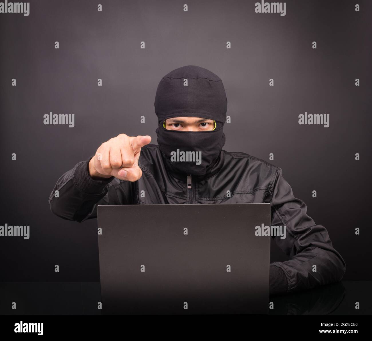 Laptop computer hacker point hand - Male thief stealing data from ...