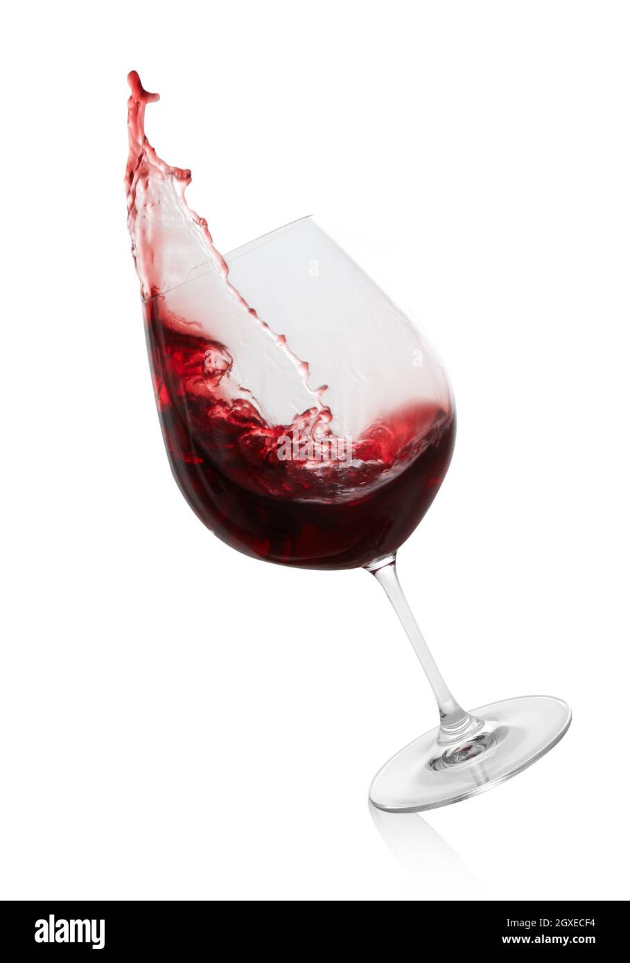Red wine splashing in a glass on white background Stock Photo - Alamy