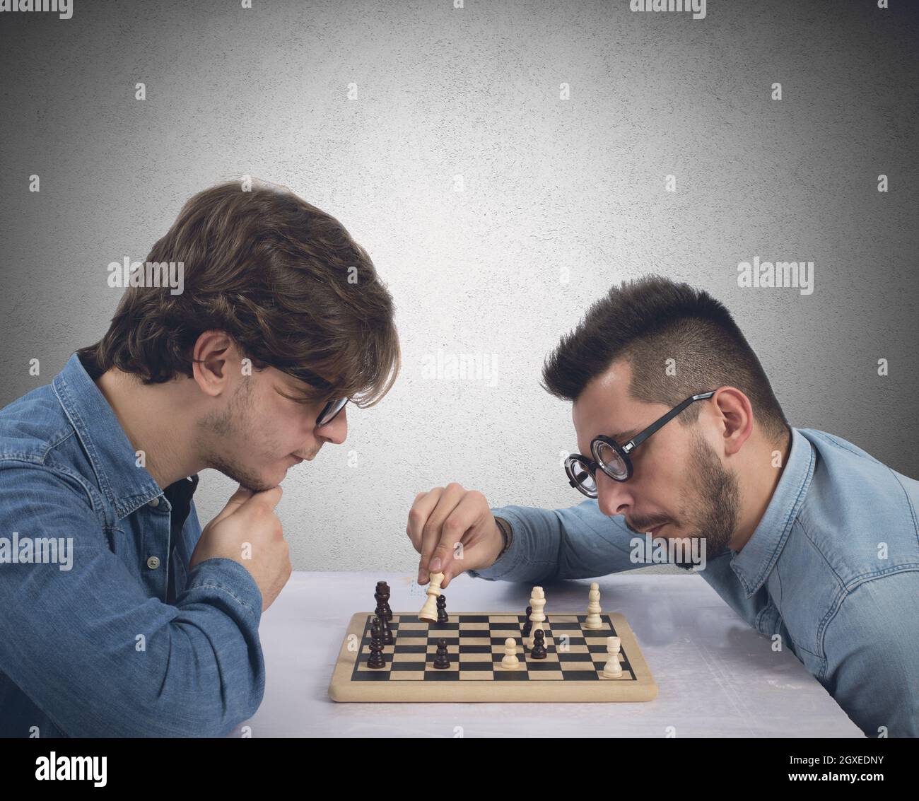 Two brothers play and compete in chess Stock Photo - Alamy