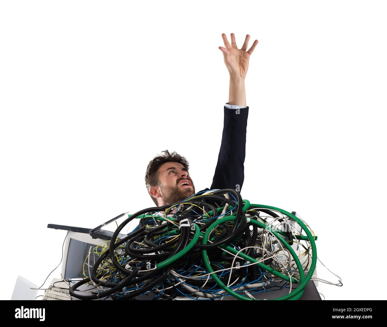 Businessman trapped by cables and computers. concept of stress and ...