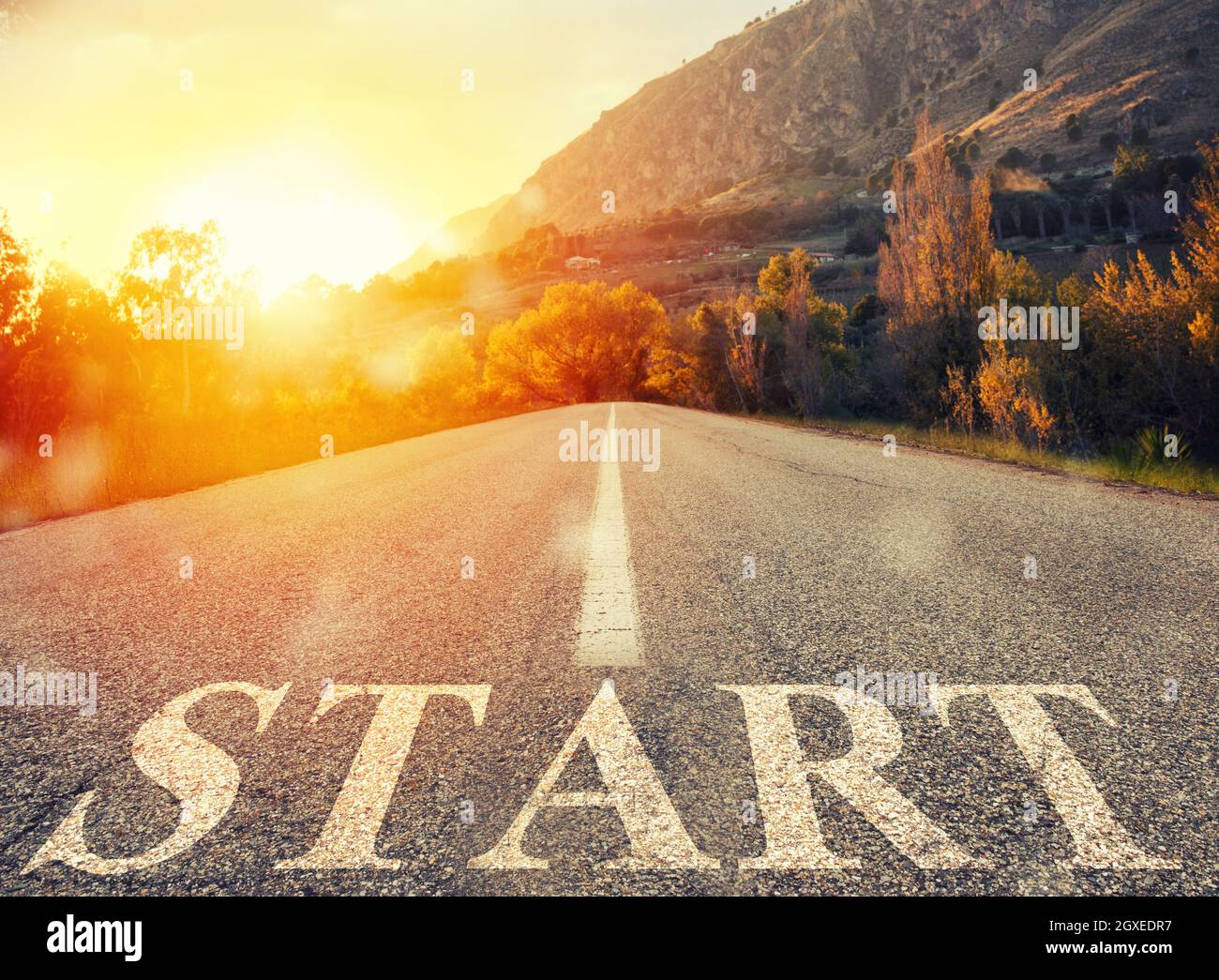 Road that says start in the asphalt. Concept of company startup Stock ...