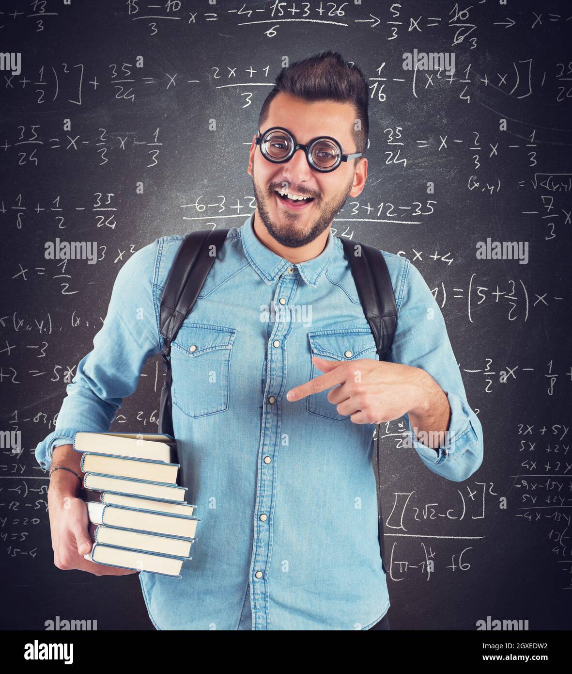 Nerd boy studying in classroom for math Stock Photo - Alamy