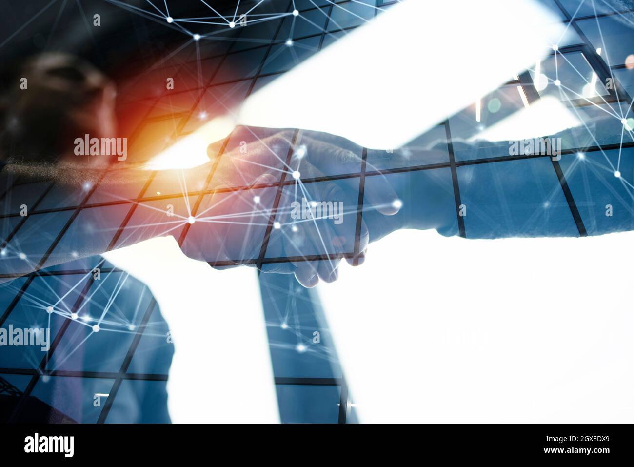 Handshaking business person in the office with network effect. concept ...