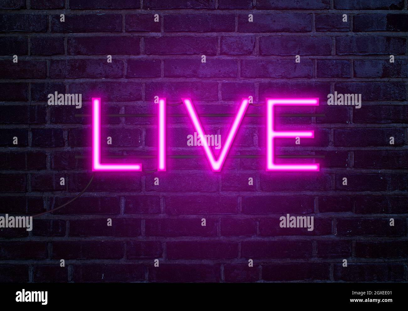 Live neon sign on brick wall Stock Photo - Alamy