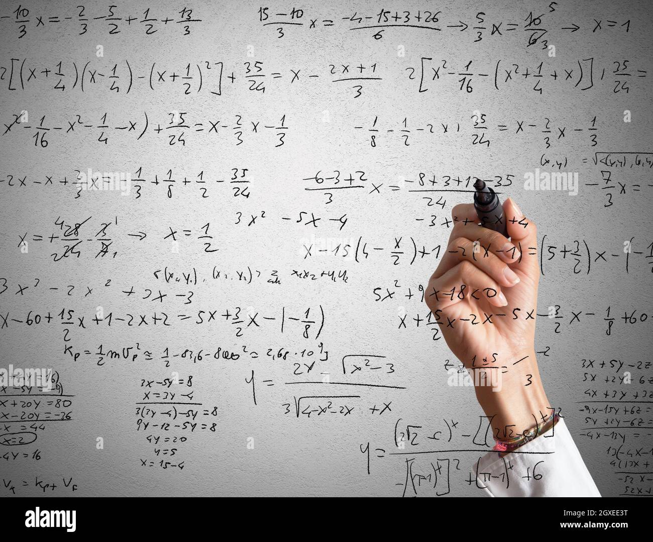 Woman explains and solves a mathematical calculation Stock Photo - Alamy