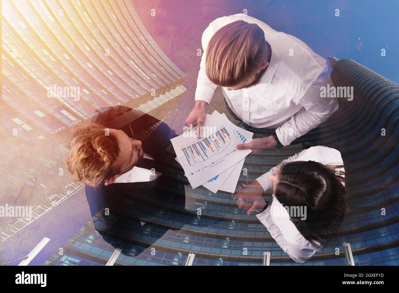 Team of people work together in office about company statistics ...