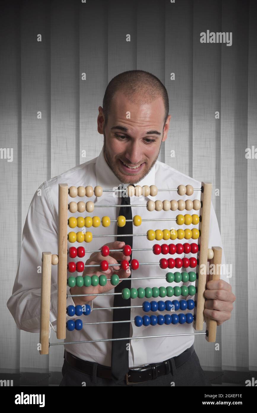 Success in the business with abacus Stock Photo - Alamy