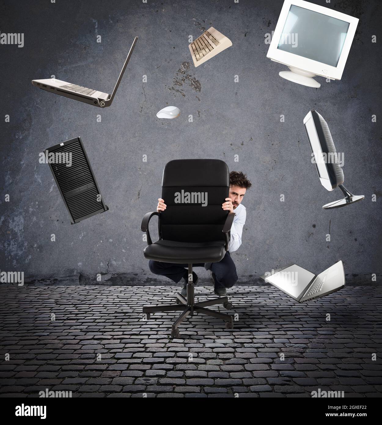 Businessman behind the chair has fear of computers and technology Stock ...