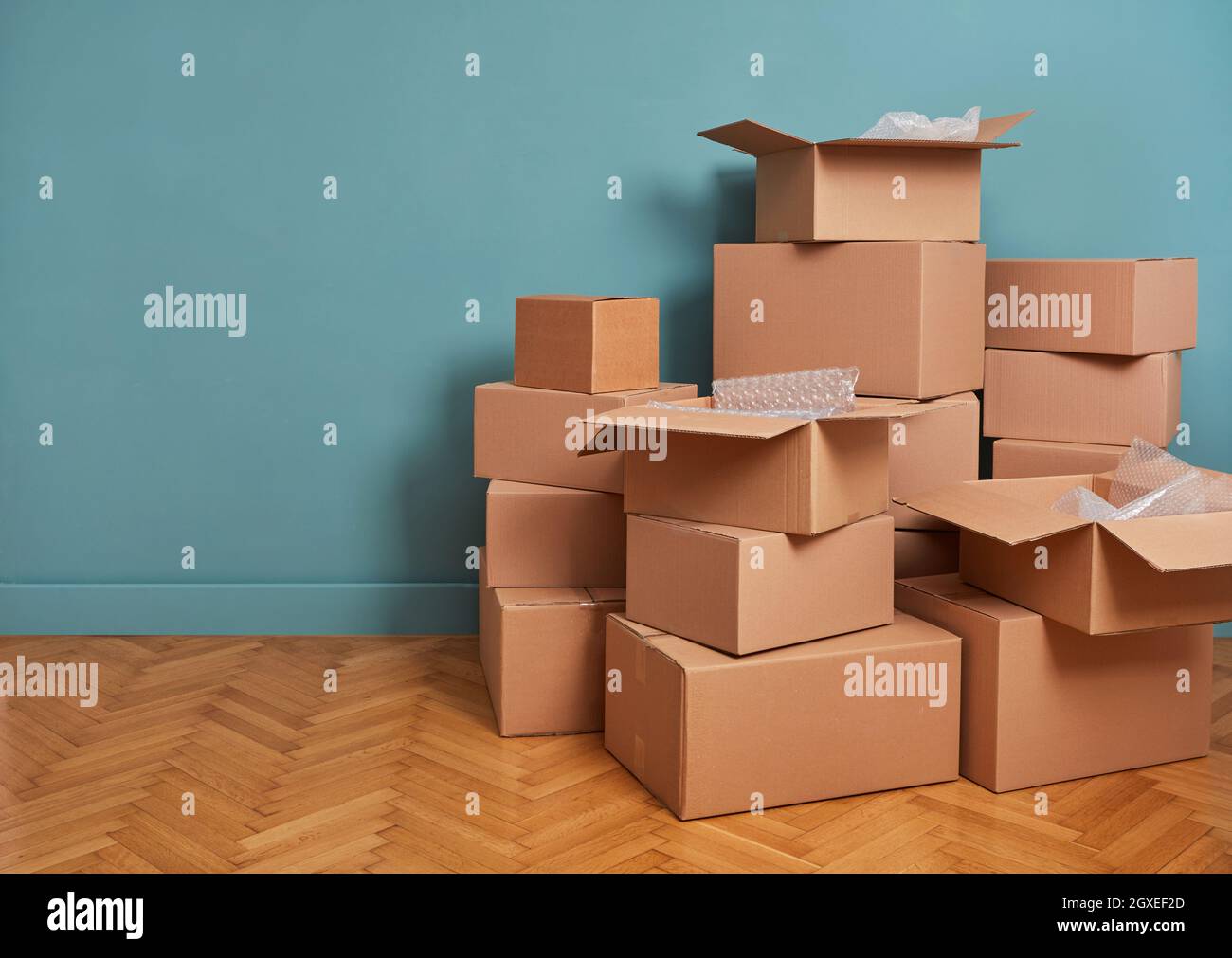 Cardboard boxes in room Stock Photo - Alamy
