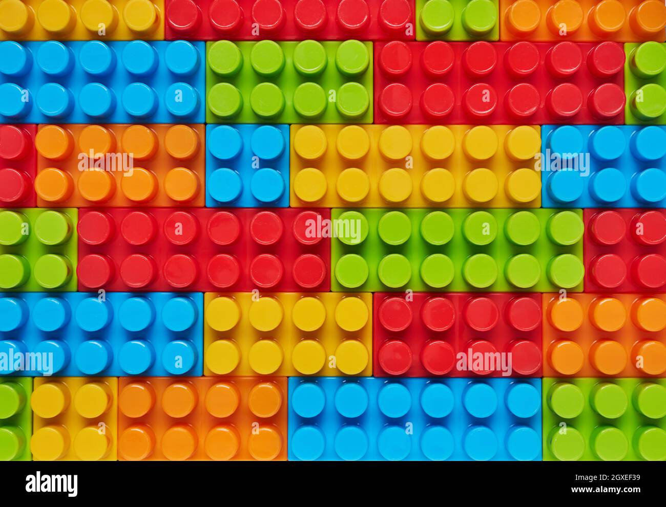 Plastic toy blocks background Stock Photo - Alamy