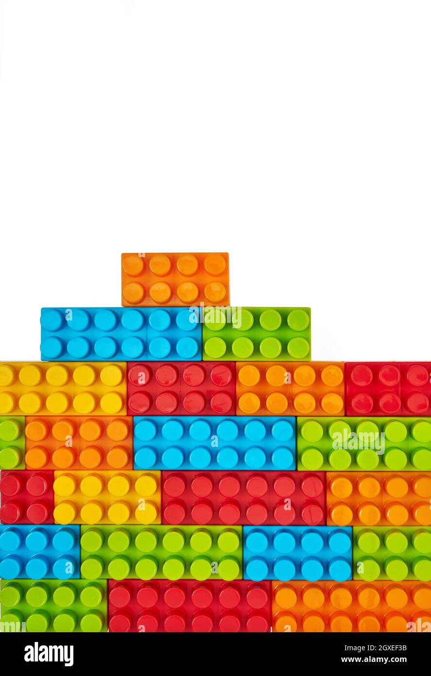 Plastic toy blocks on white background Stock Photo - Alamy