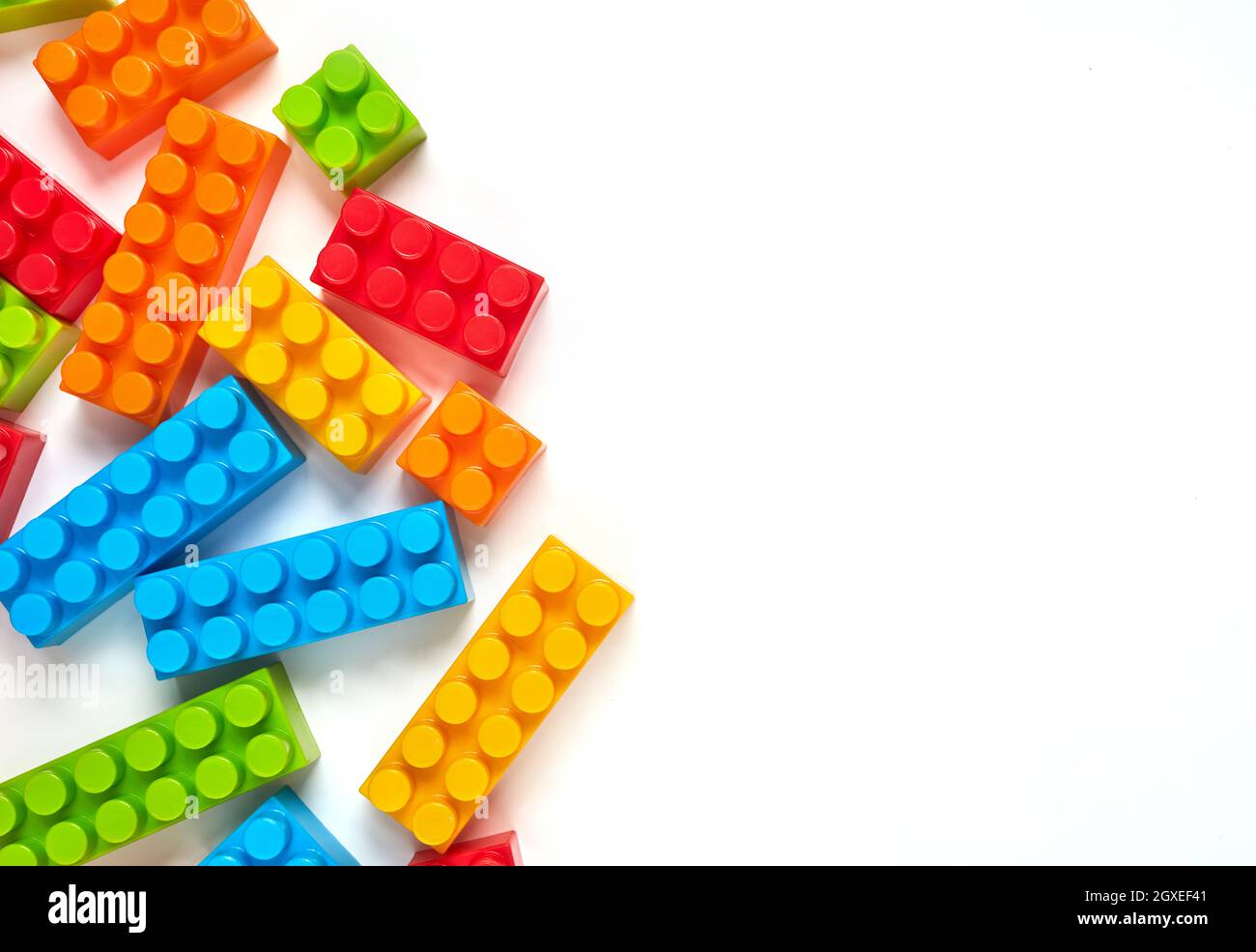 Plastic toy blocks on white background Stock Photo - Alamy