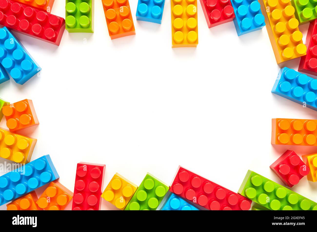 Plastic toy blocks on white background Stock Photo - Alamy