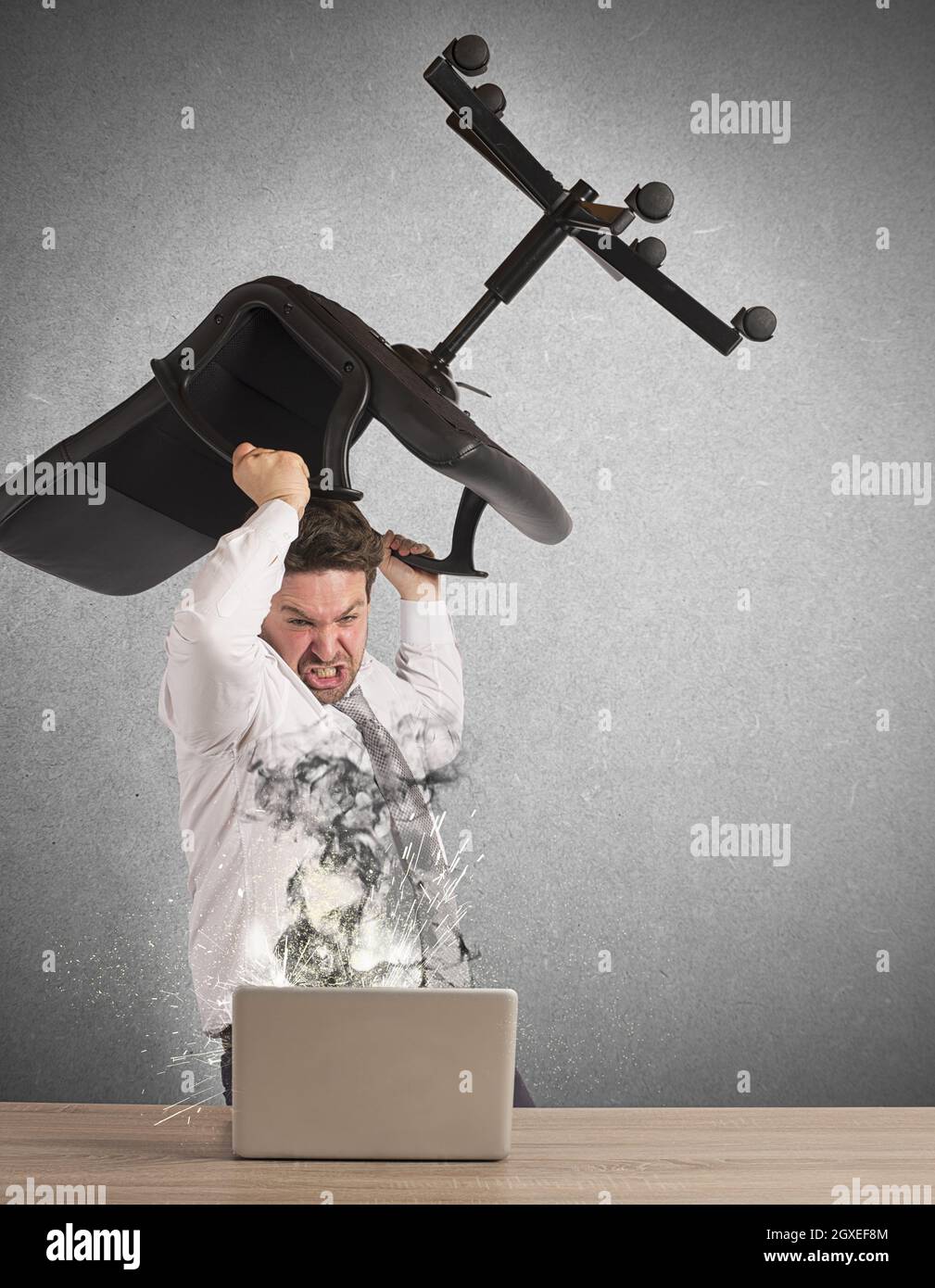 Stressed businessman breaks the computer with chair Stock Photo - Alamy