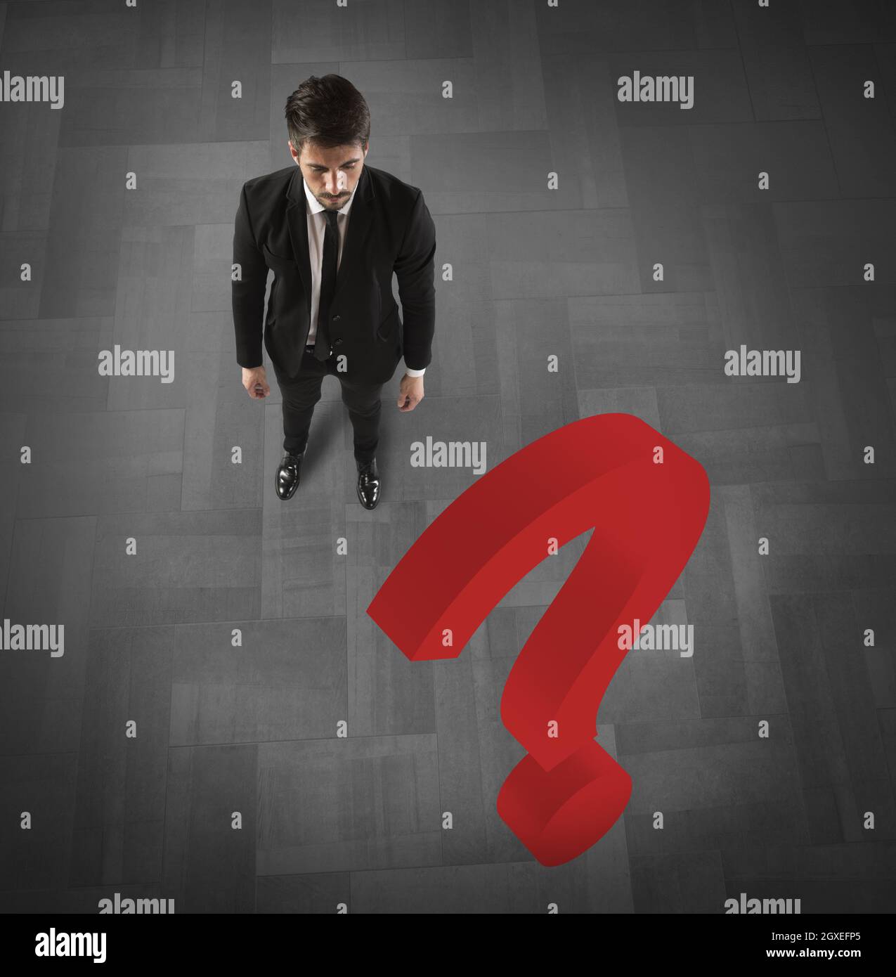 Businessman with a big red question mark Stock Photo - Alamy