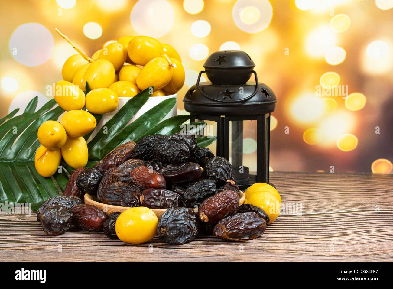 Bunch of different types of dates mixed together with lantern and leaf ...