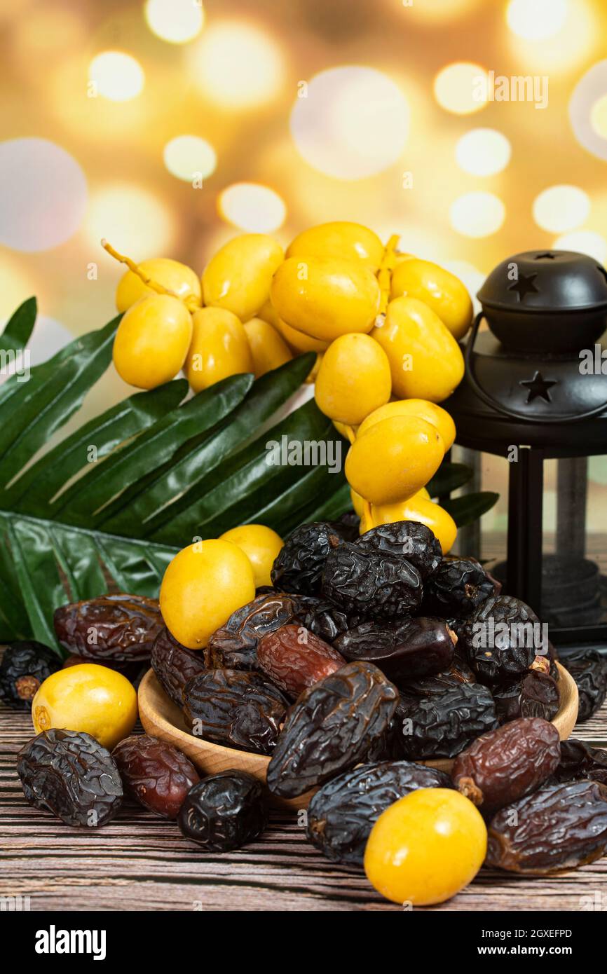 Bunch of different types of dates mixed together with lantern and leaf ...